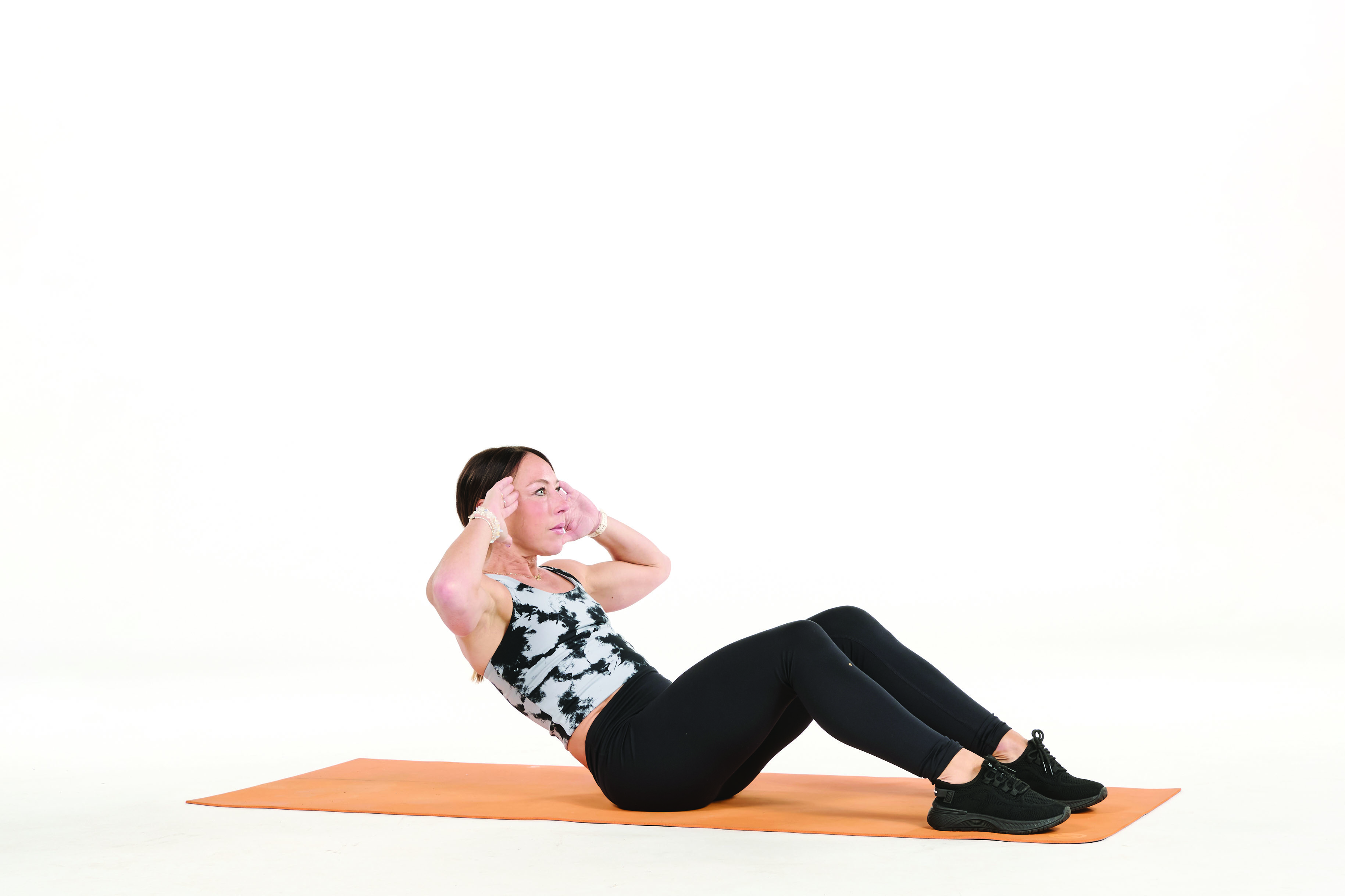Try these sit-ups exercises to work your core - Women's Fitness